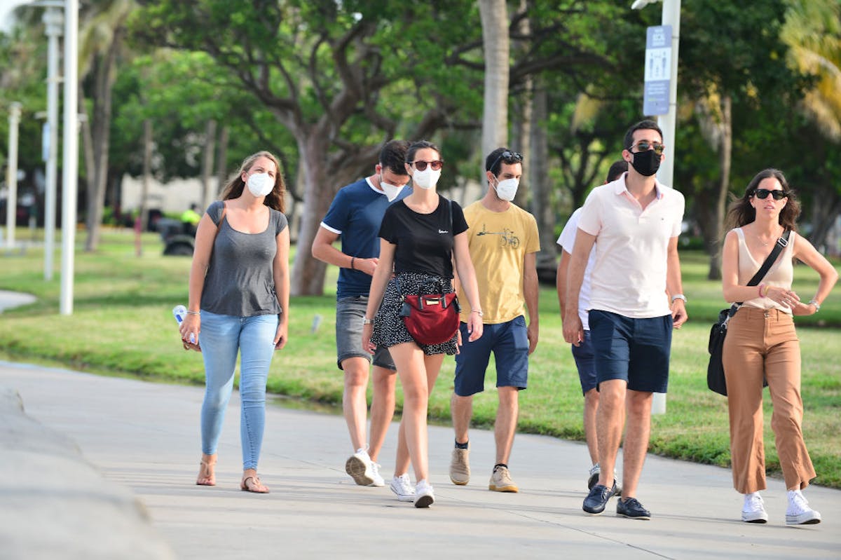 Health Expert: Mask Wearing, Some Social Distancing Will Continue For ...