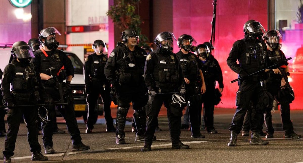 Protester Dubbed ‘Naked Athena’ Faces Off With Portland Police