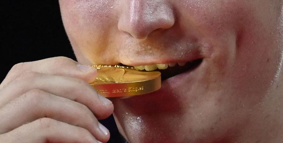 Japanese Mayor Bites Athlete’s Gold Medal, Apologizes | The Daily Wire