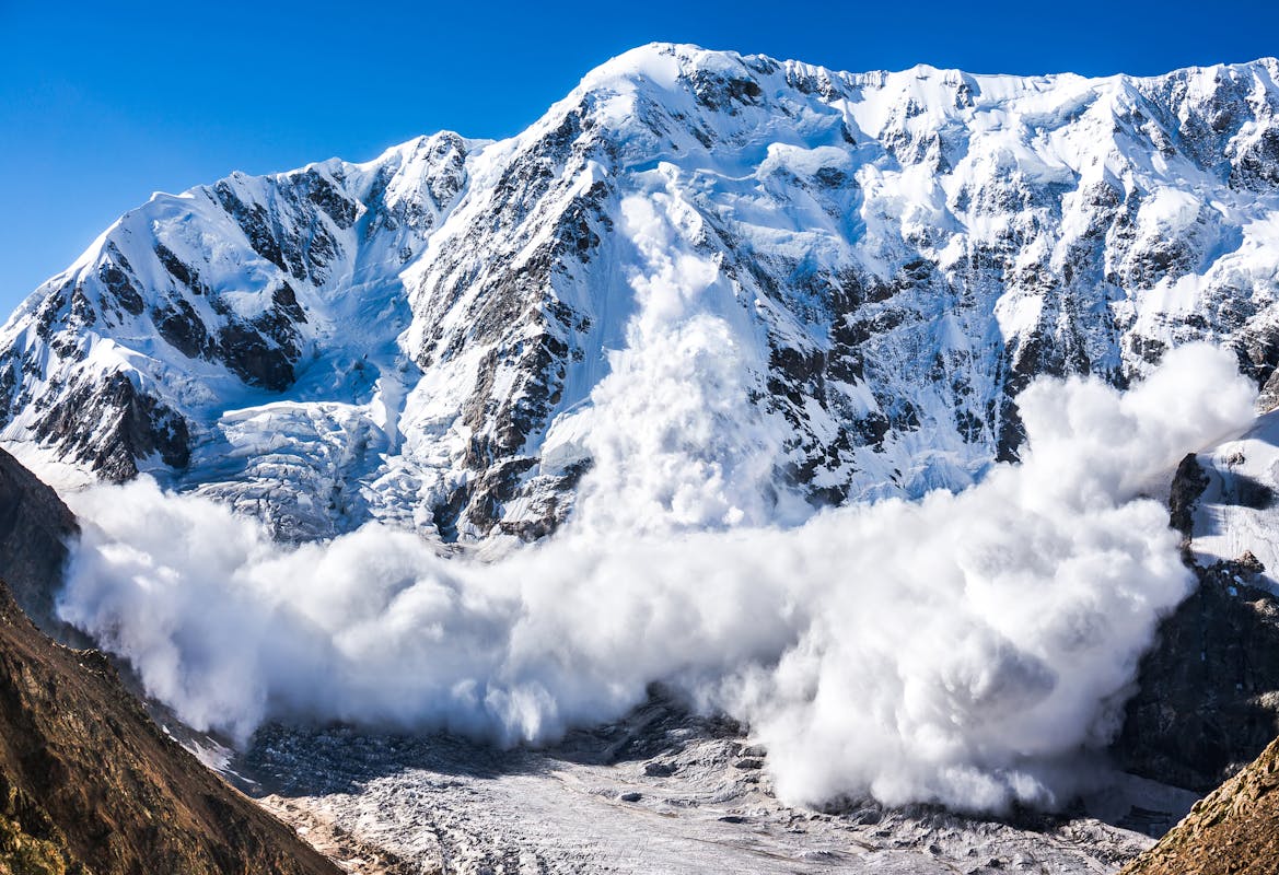 WATCH: Tourist Escapes Avalanche Roaring Down Mountain Over Him
