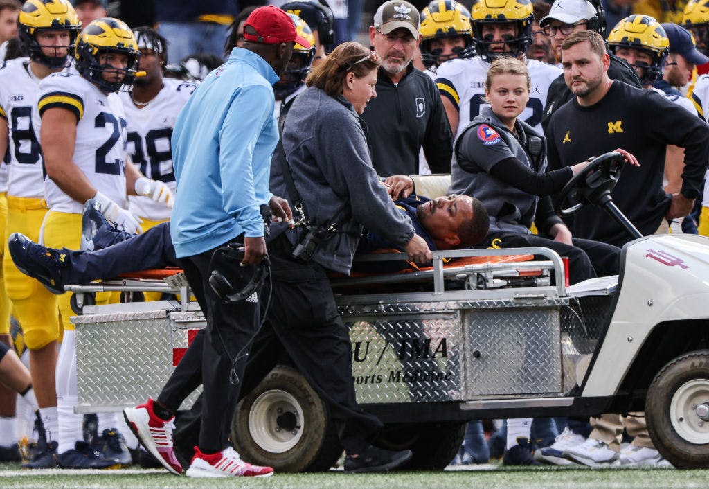 Michigan Football Coach, Former NFL Player Collapses On Sideline During ...