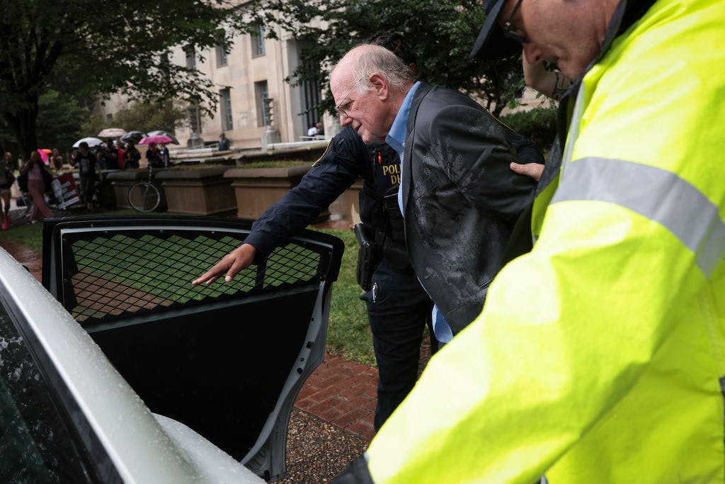 PHOTOS: Ben & Jerry’s Founder Arrested At DOJ During Julian Assange Protest
